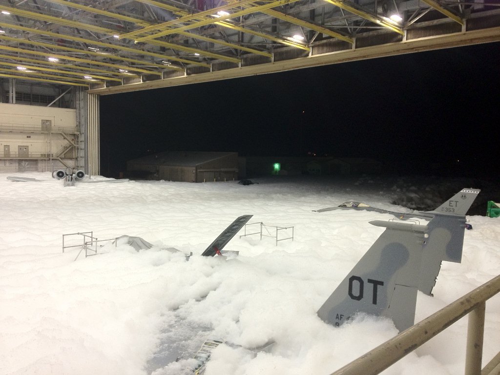 Foam party! Hangar fire suppression system submerges F-15, F-16 and A ...