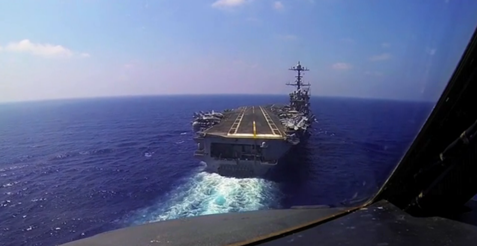 Extremely rare: U.S. Navy plane lands on snow-covered aircraft carrier ...