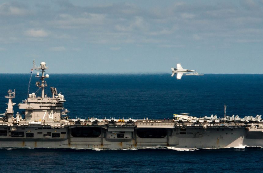U.S. F/A-18Es performed an airborne change of command in the skies near ...