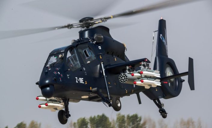 This photo of AH-64 Apache helicopter salvoing flares in the dark is ...