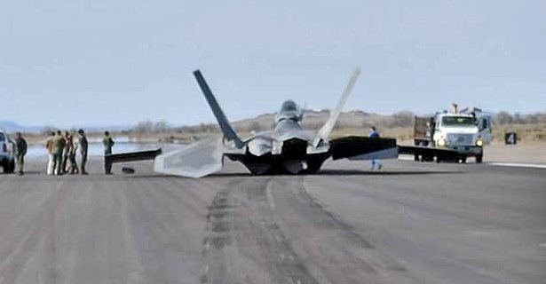 Premature Landing Gear Retraction Resulted In F-22 Raptor Sliding On ...